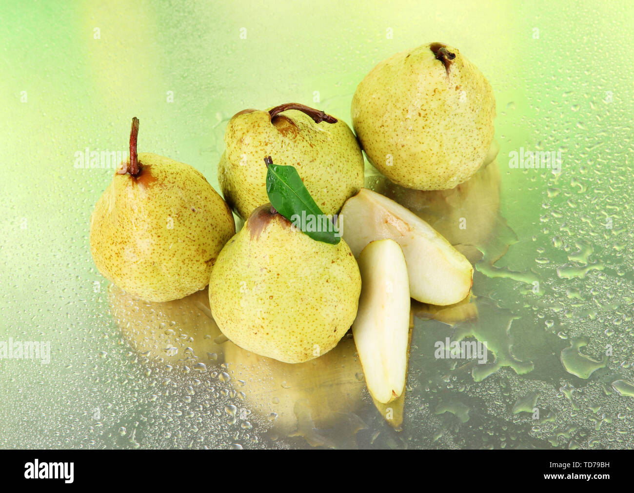 Pears on nature background Stock Photo - Alamy