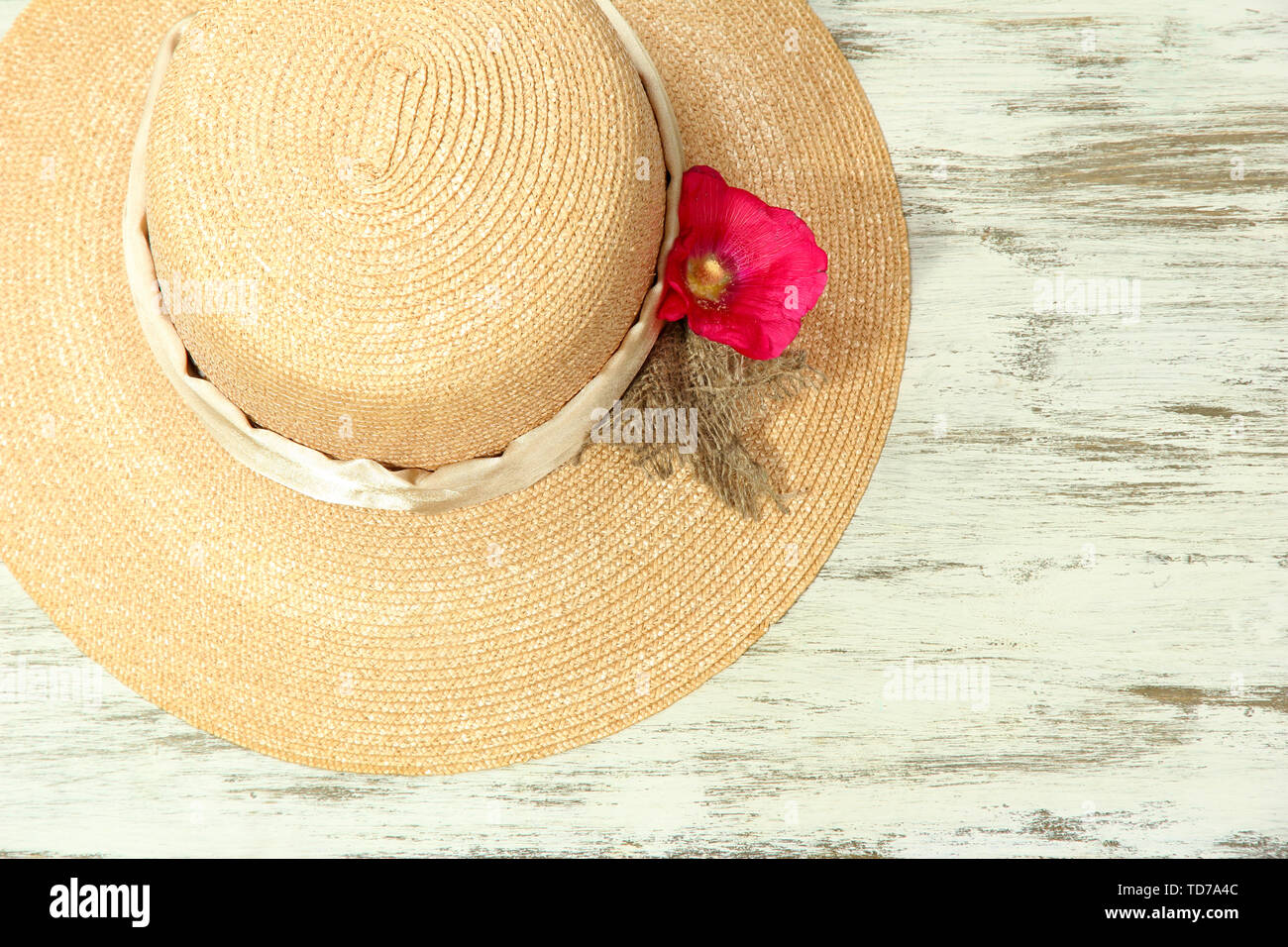 Beautiful summer hat on wooden background Stock Photo - Alamy