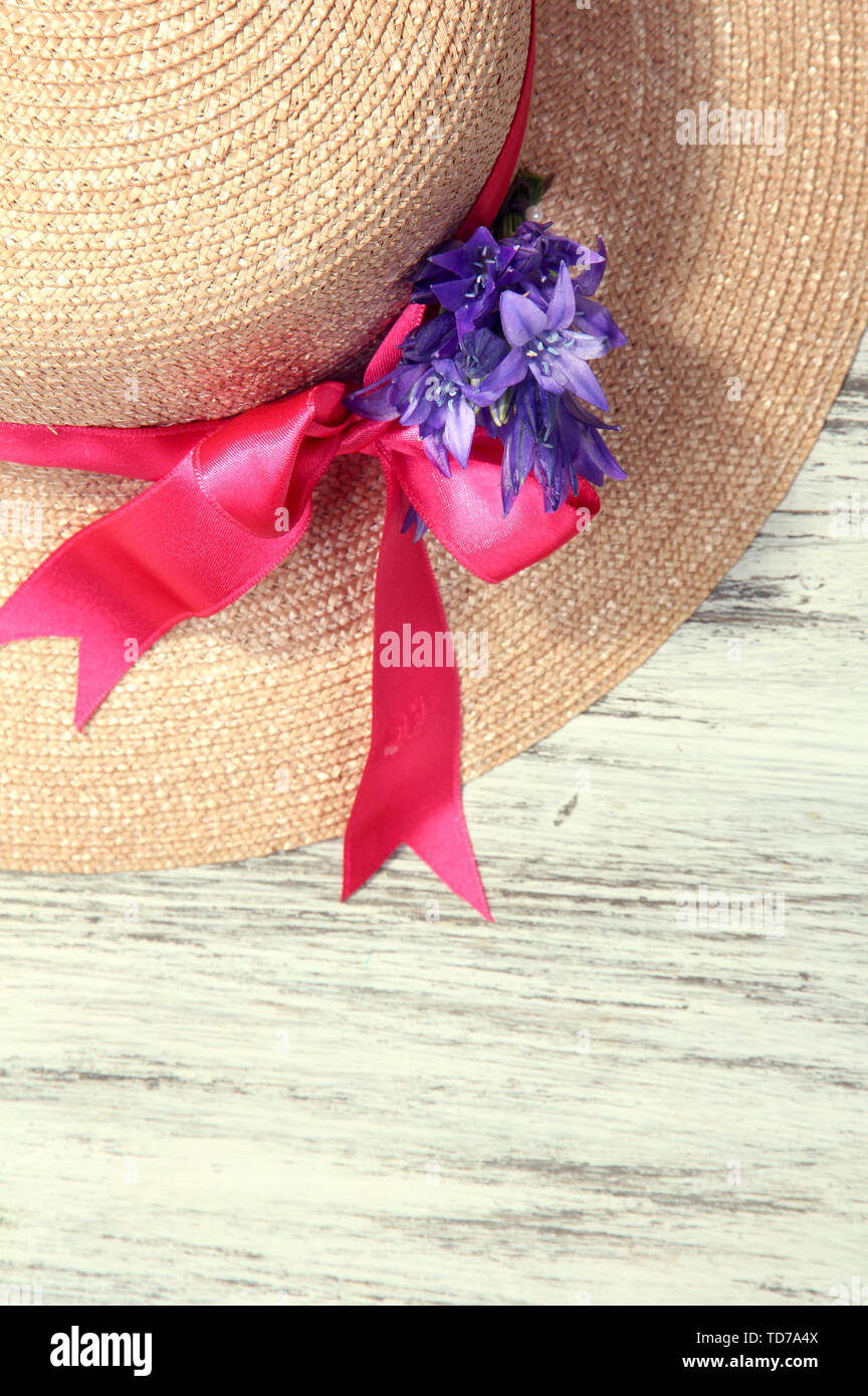 Beautiful summer hat on wooden background Stock Photo - Alamy
