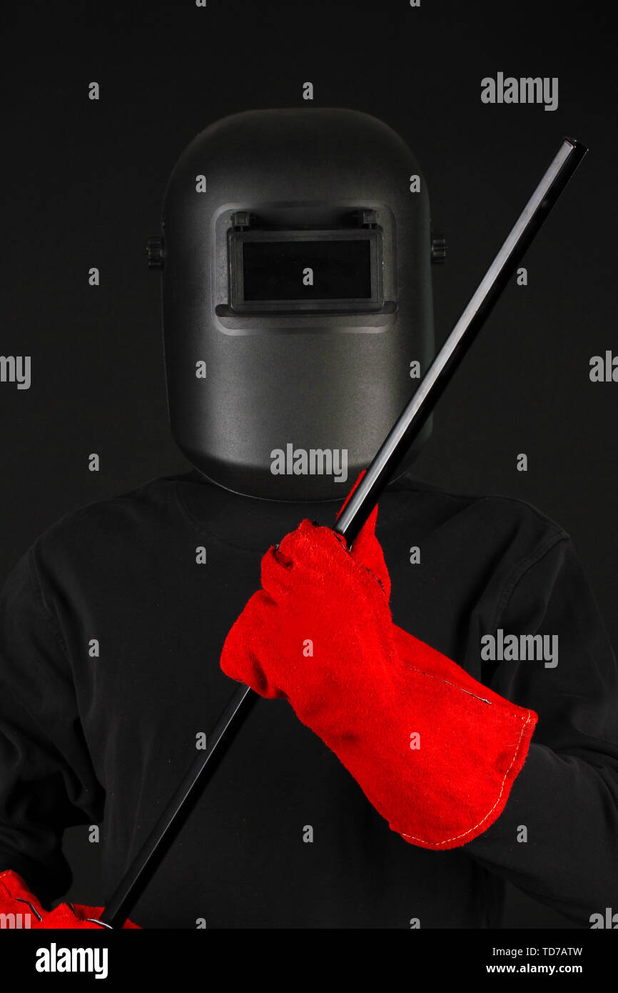 Portrait of welder in mask, isolated on black Stock Photo - Alamy