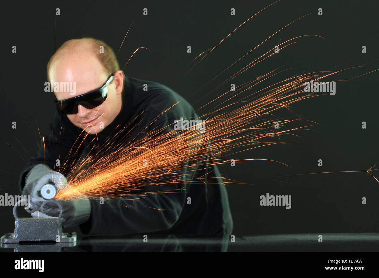 Portrait of workman in black glasses, isolated on black Stock Photo - Alamy