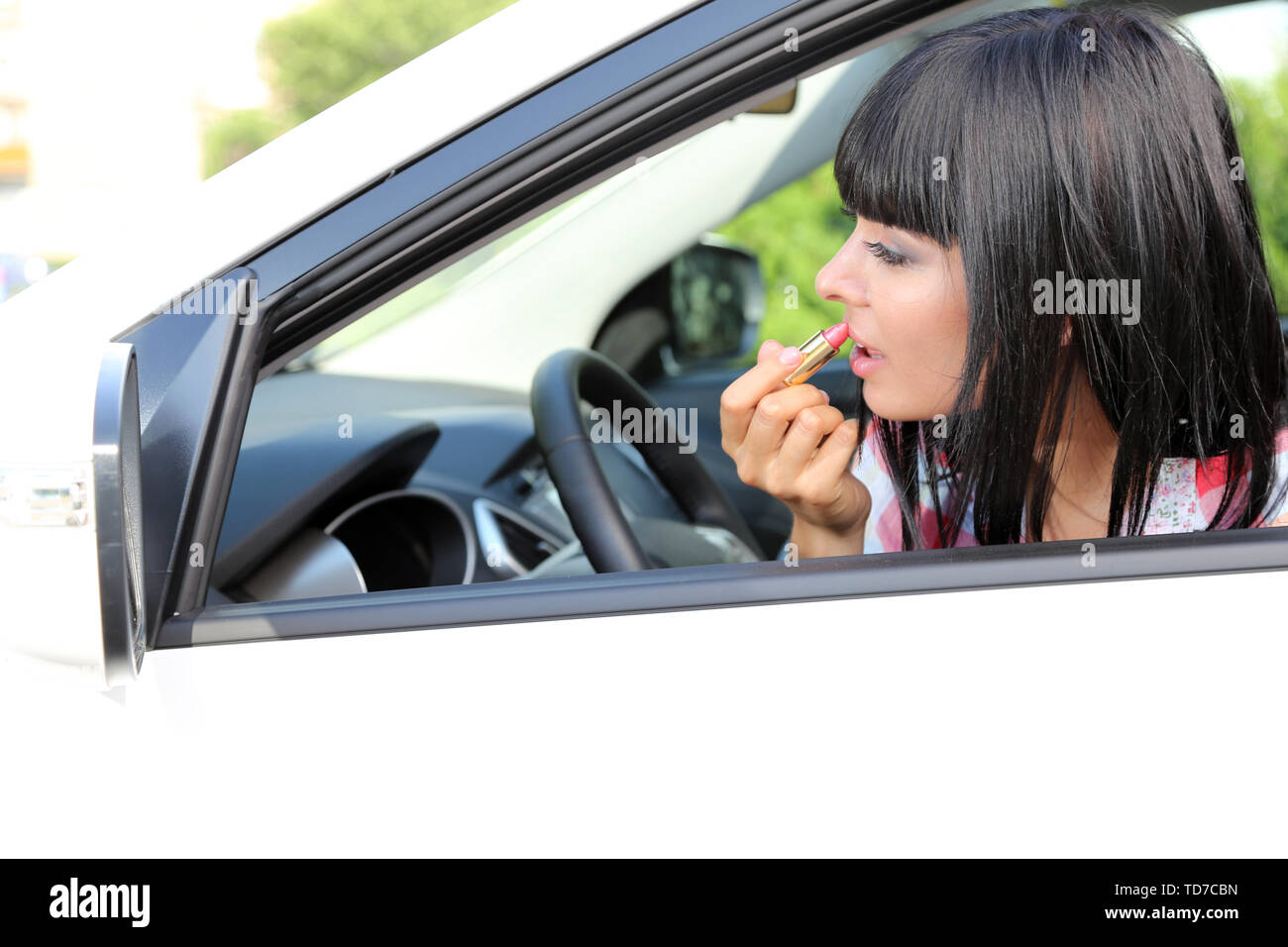 Woman applying makeup in car hi-res stock photography and images - Alamy