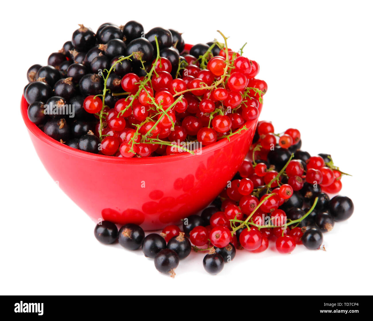 Red and black currant in bowl isolated on white Stock Photo - Alamy