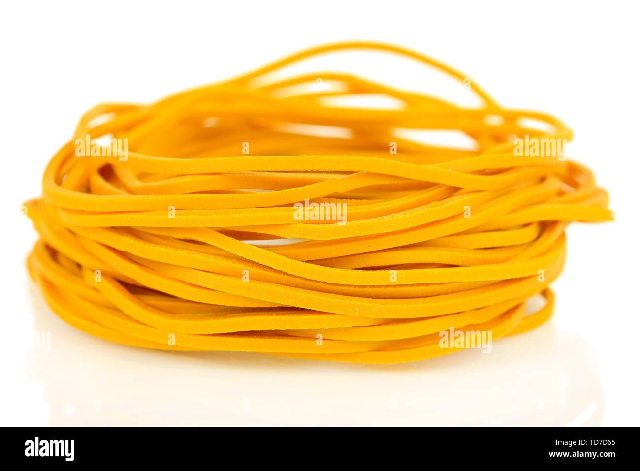 Yellow rubber bands isolated on white Stock Photo - Alamy