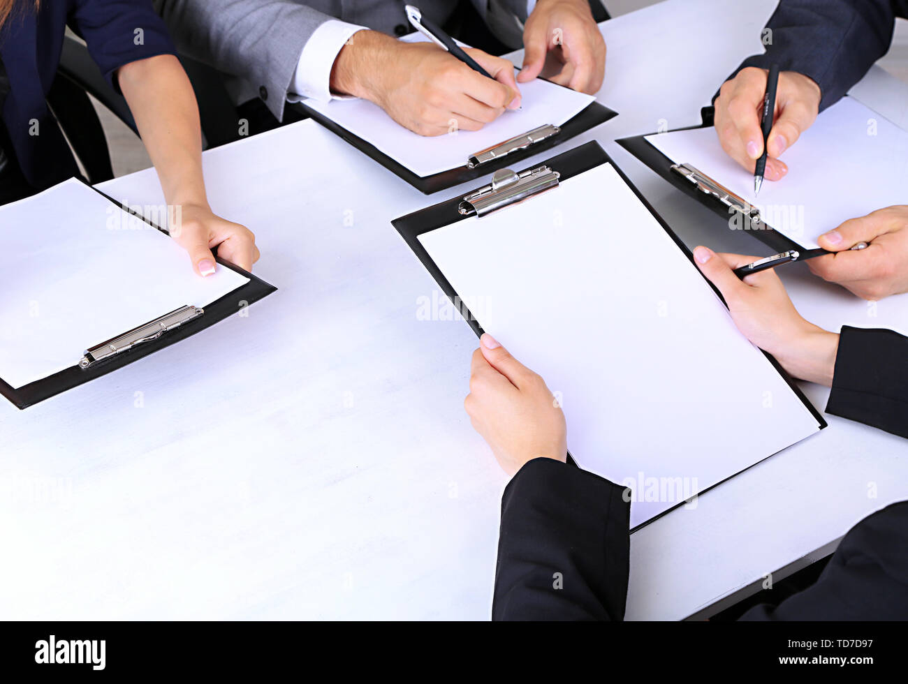 hands of business people at work in the office close up Stock Photo - Alamy