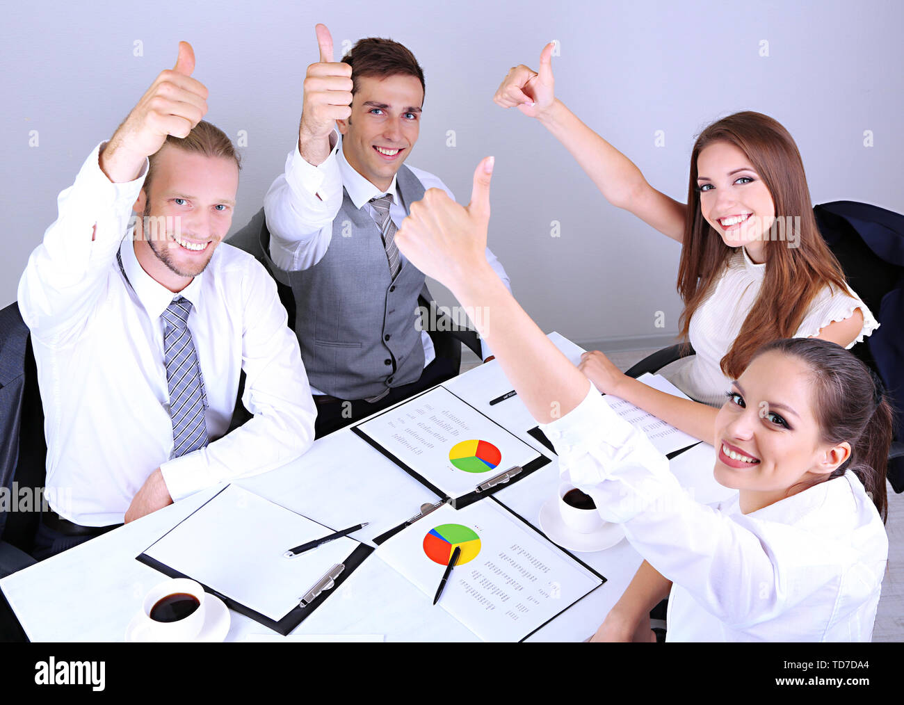 Group of business people having meeting together Stock Photo - Alamy