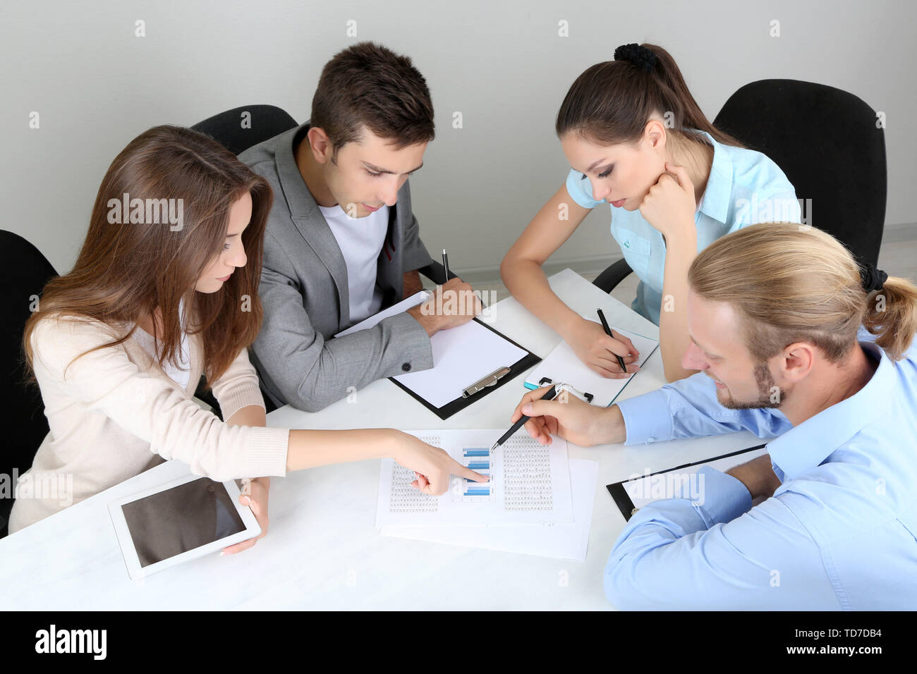 Business team working on their project together at office Stock Photo ...