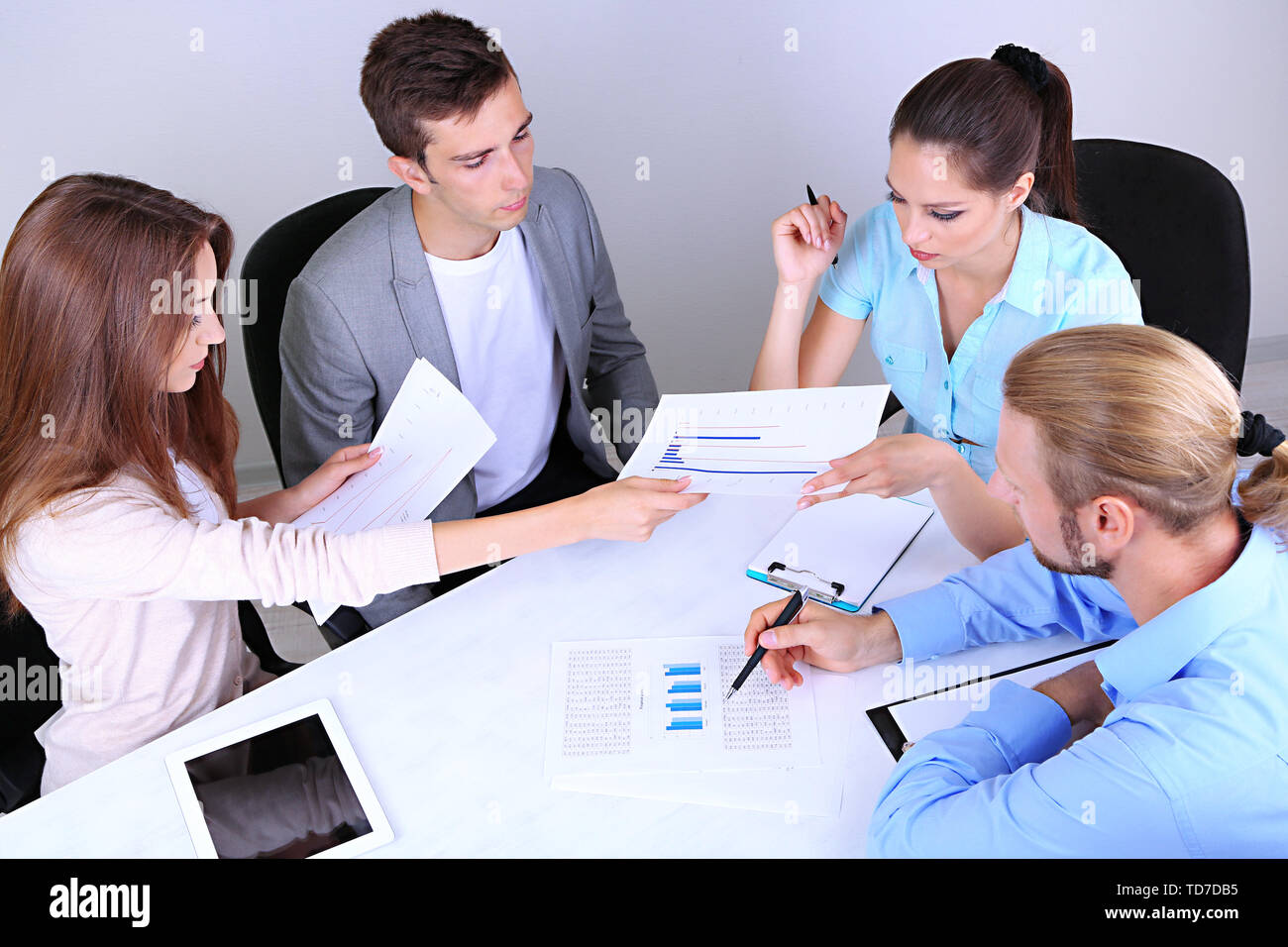 Business team working on their project together at office Stock Photo ...