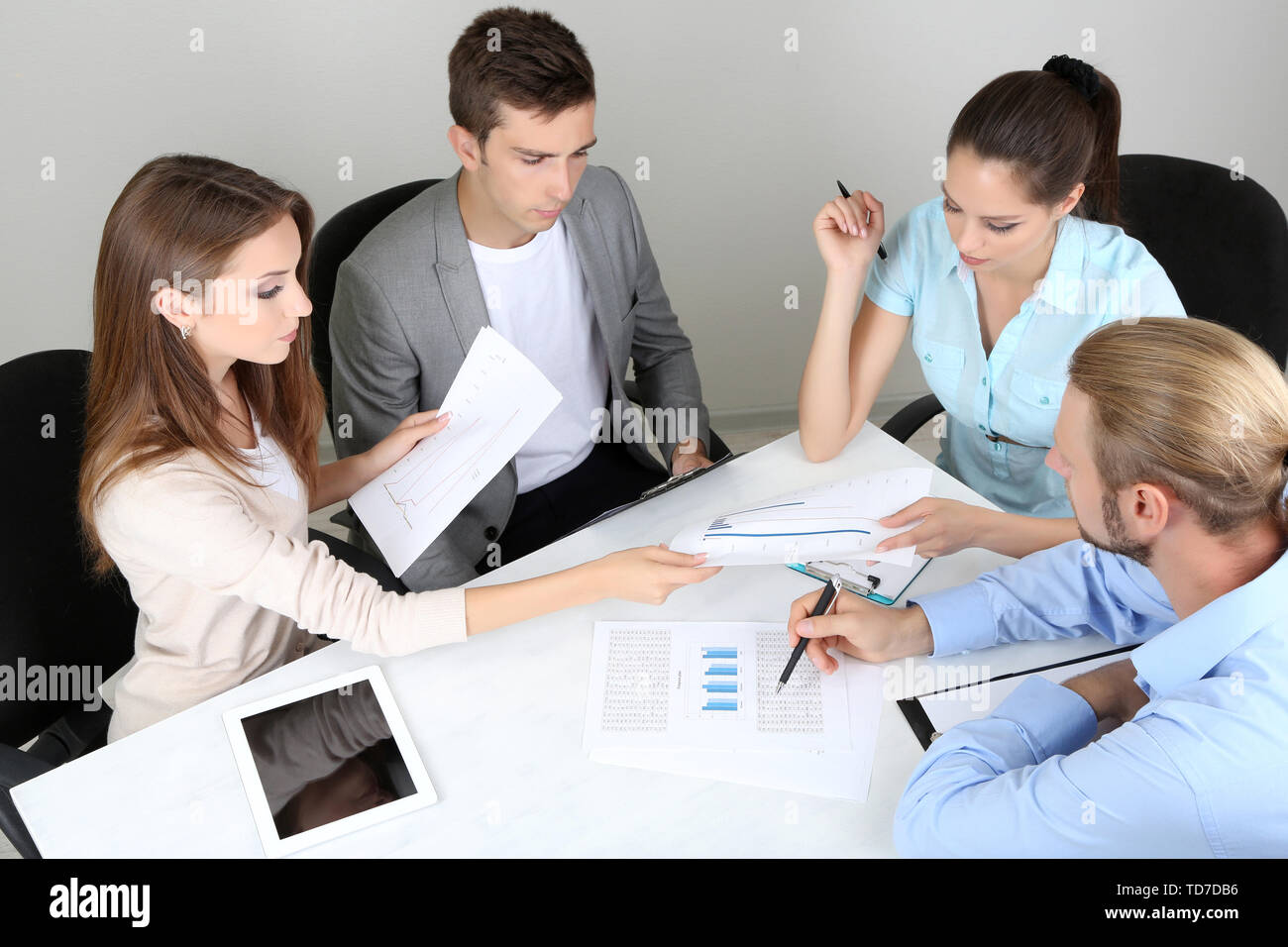 Business team working on their project together at office Stock Photo ...