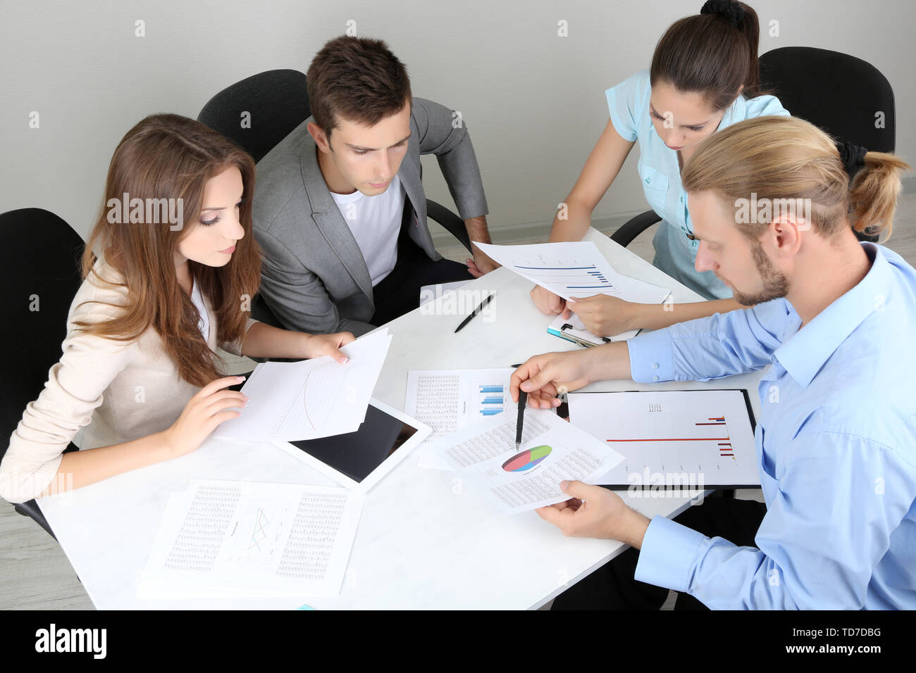 Business team working on their project together at office Stock Photo ...