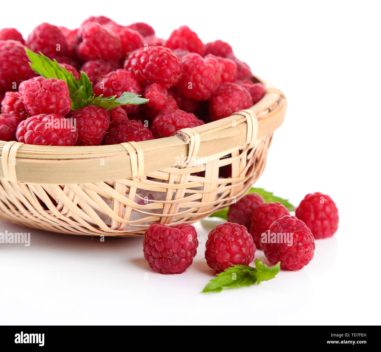 Ripe sweet raspberries in basket, isolated on white Stock Photo - Alamy