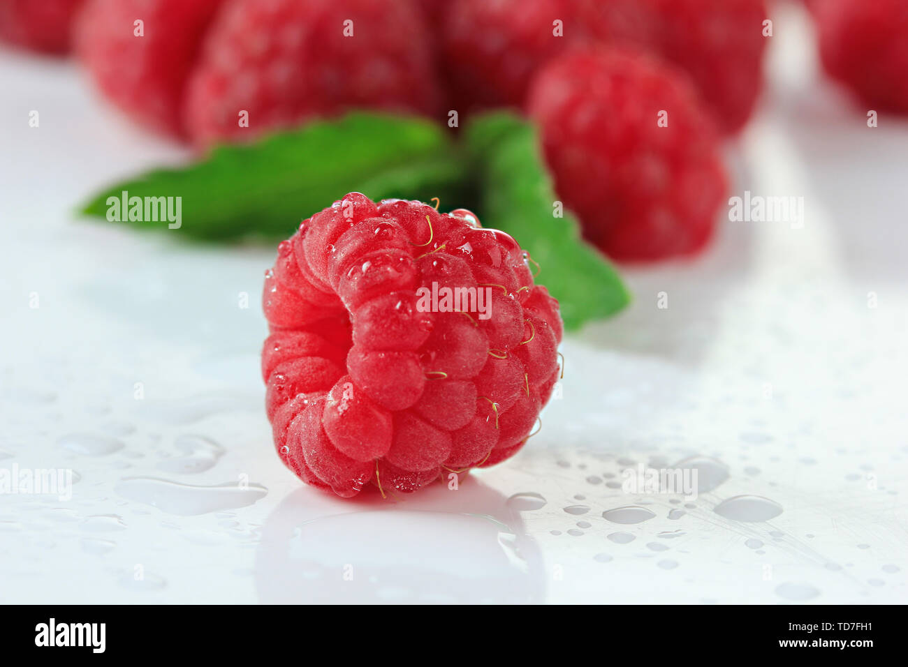 Ripe sweet raspberries isolated on white Stock Photo - Alamy
