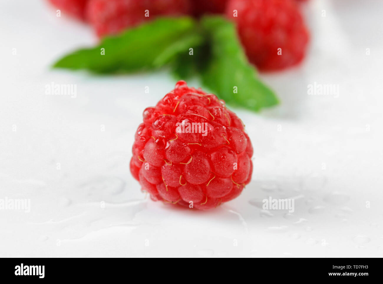Ripe sweet raspberries isolated on white Stock Photo - Alamy