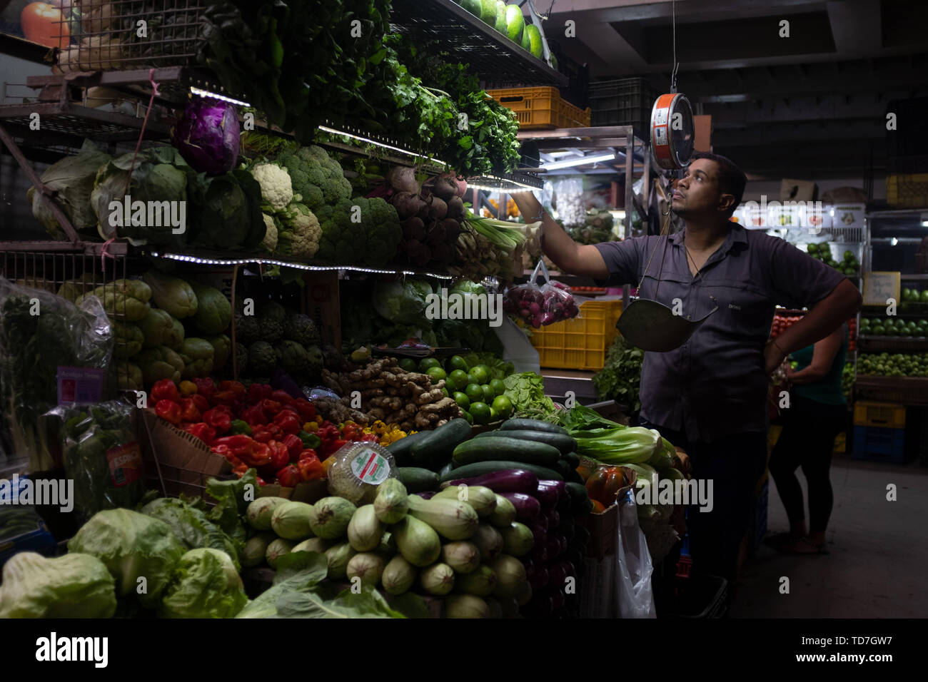 Caracas, Venezuela. 6th June, 2019. A man stands at his market in ...