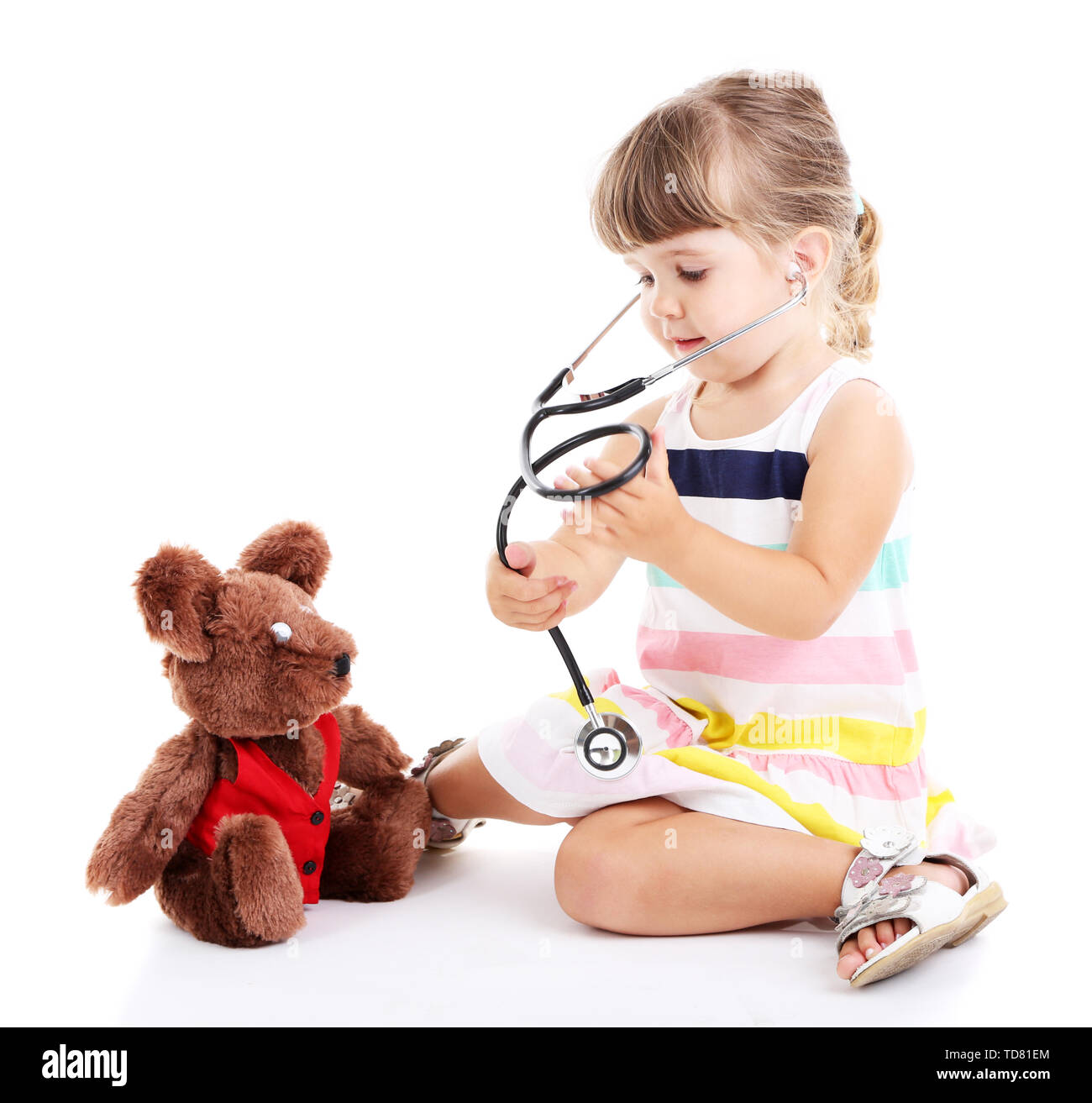 Little cute girl playing doctor, isolated on white Stock Photo - Alamy