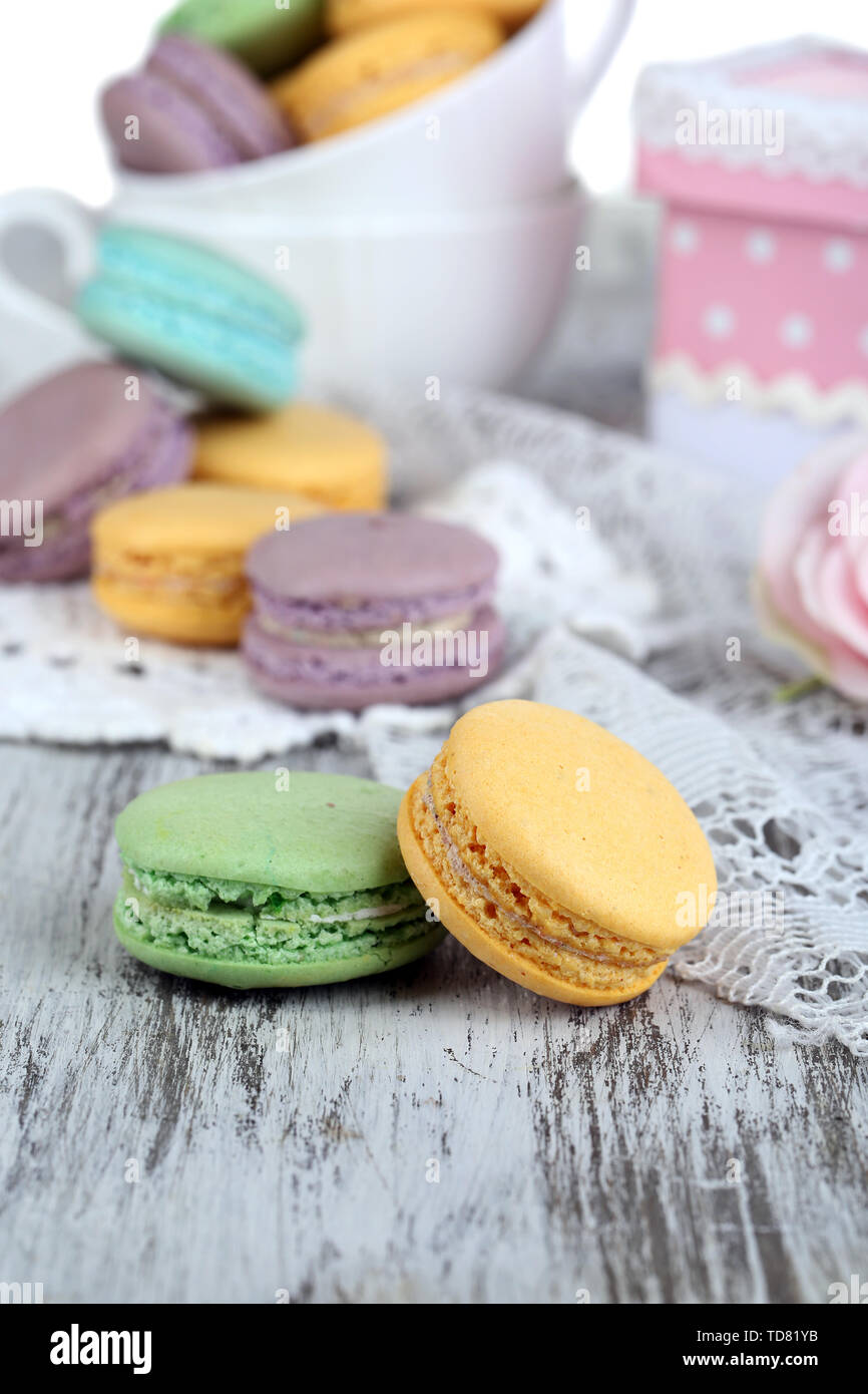 Macaroons in bowl on wooden table close-up Stock Photo - Alamy