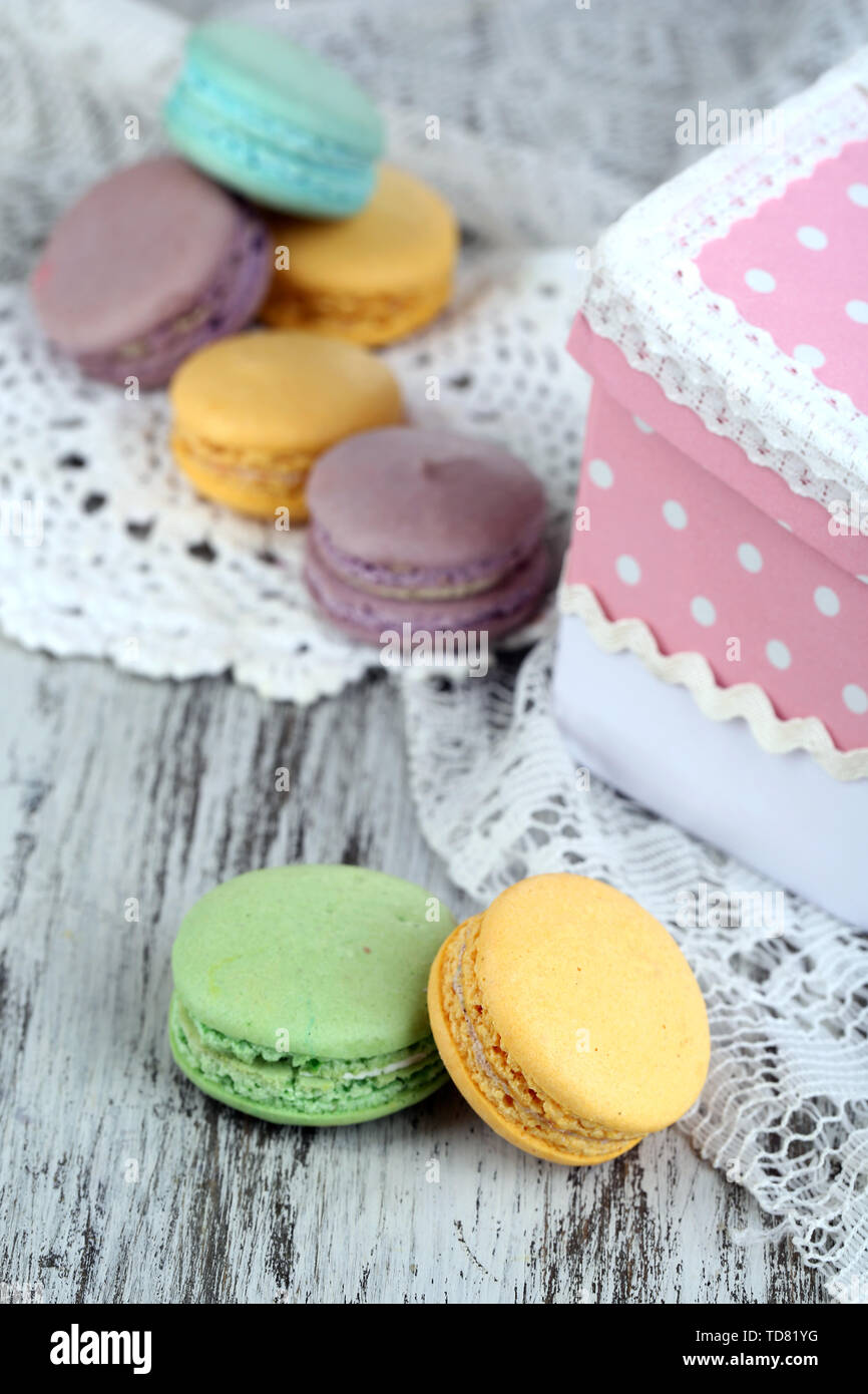 Macaroons in bowl on wooden table close-up Stock Photo - Alamy