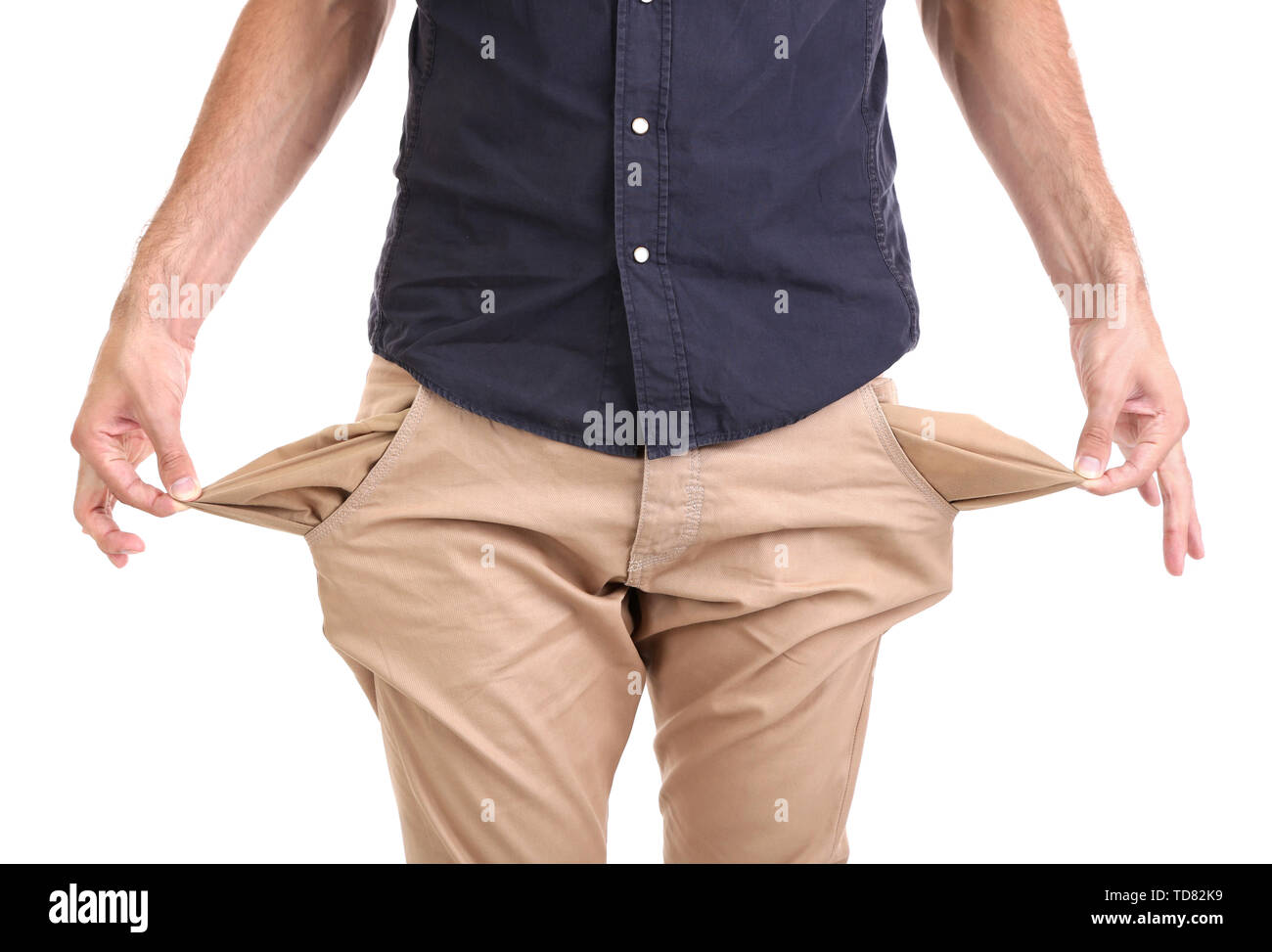 Man showing his empty pockets, isolated on white Stock Photo - Alamy