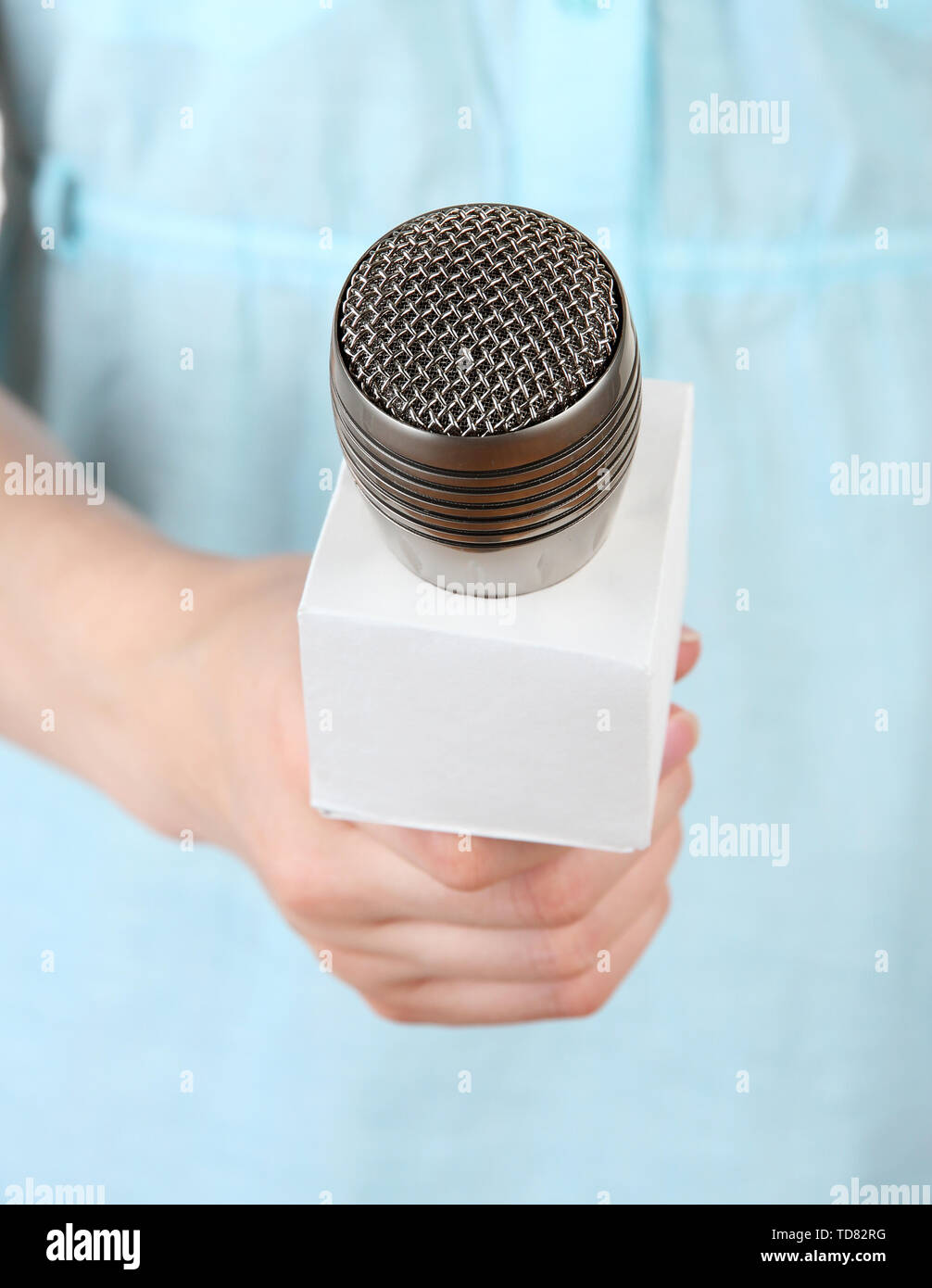 Female with microphone close-up background Stock Photo - Alamy