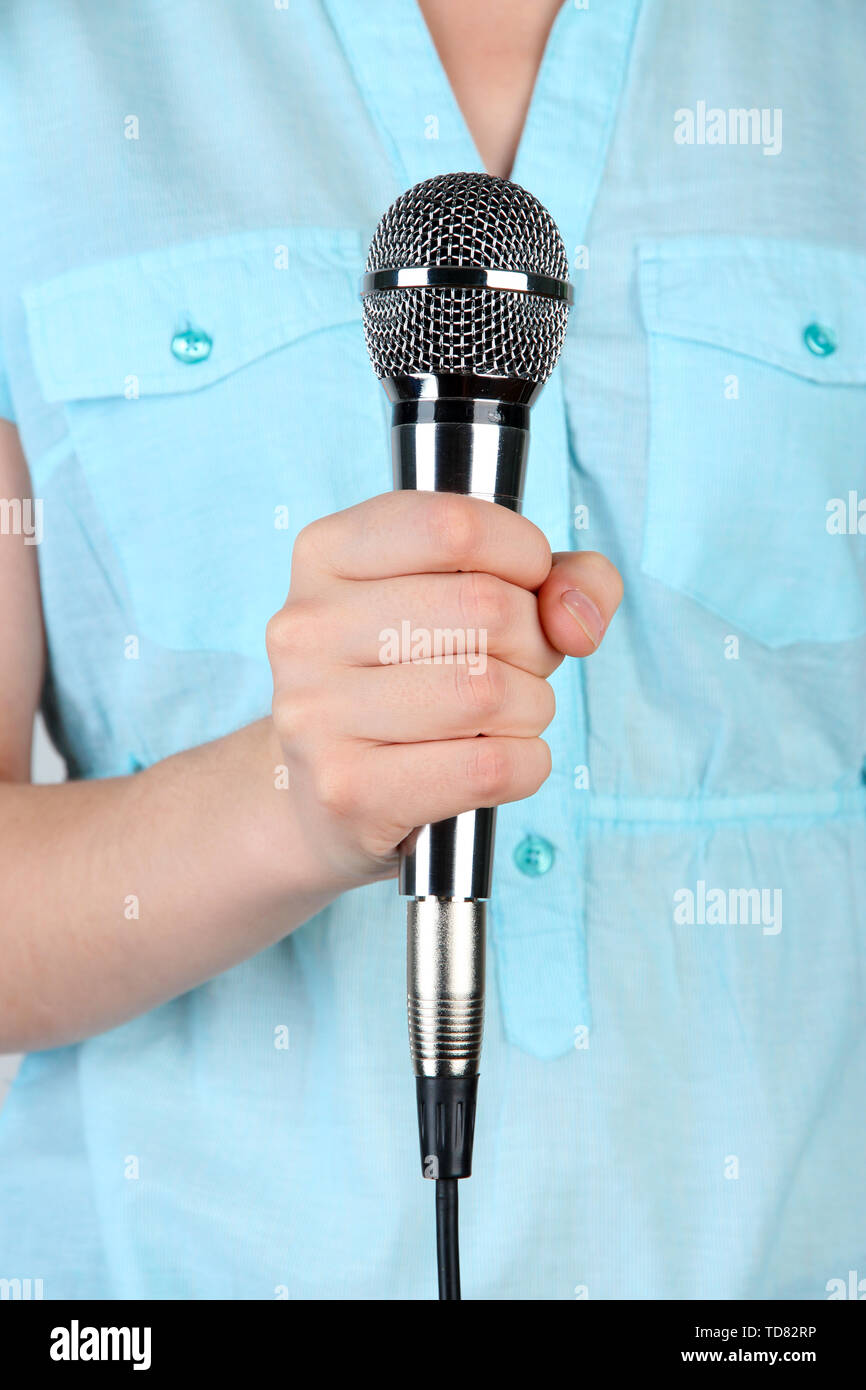 Female with microphone close-up background Stock Photo - Alamy
