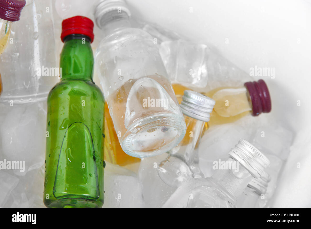 Minibar bottles with ice cubes, close-up Stock Photo - Alamy
