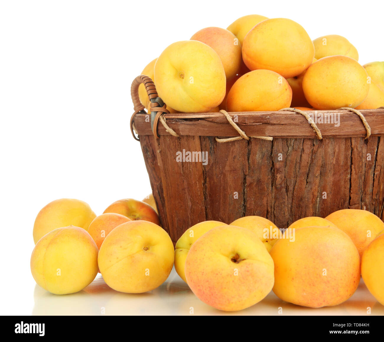 Fresh natural apricot in basket isolated on white Stock Photo - Alamy