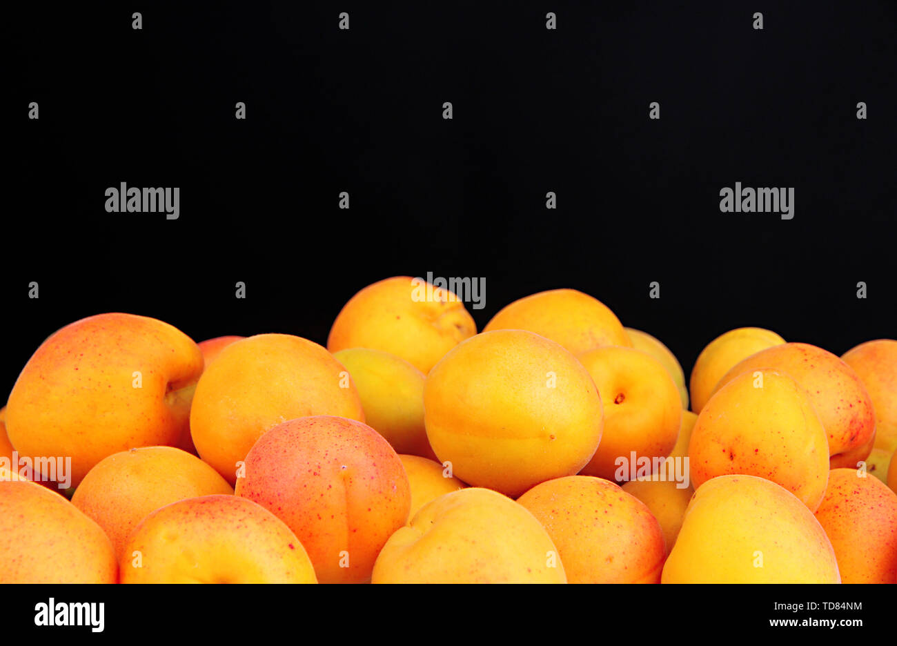 Fresh natural apricot on black background Stock Photo - Alamy