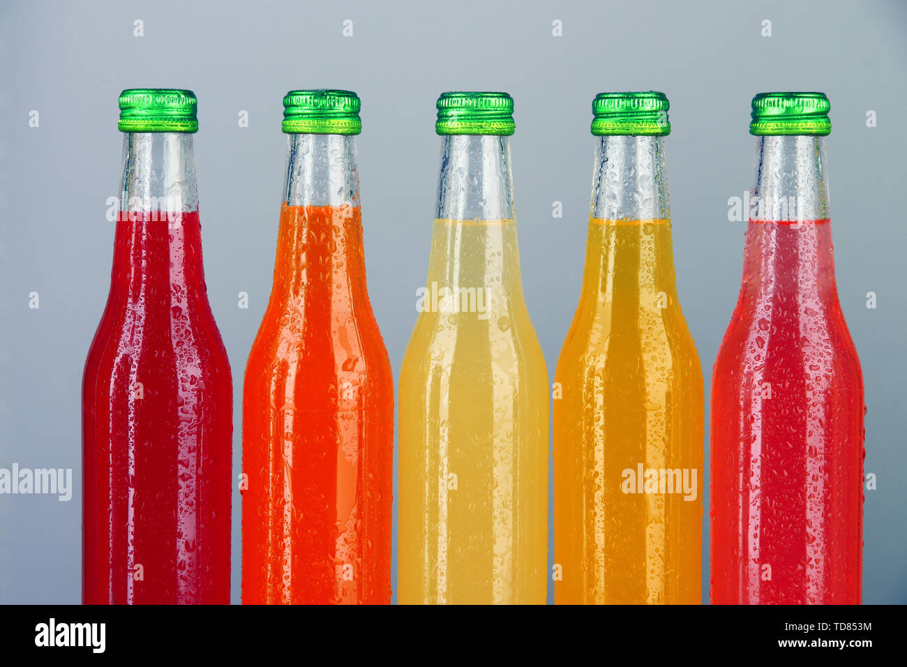Bottles with tasty drinks, isolated on white Stock Photo - Alamy