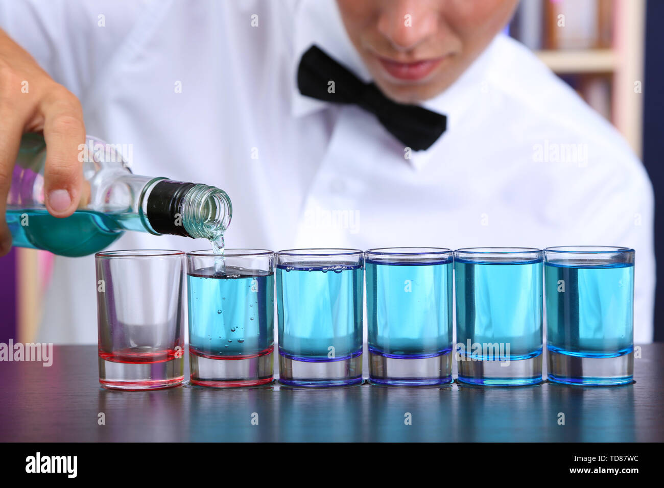 Bartender pouring blue curacao liquor hi-res stock photography and images - Alamy