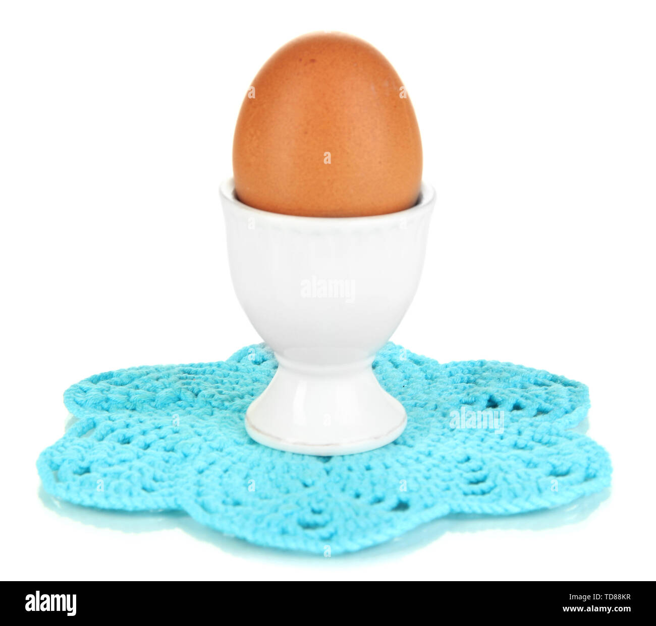 Whole boiled egg in egg cup isolated on white Stock Photo - Alamy