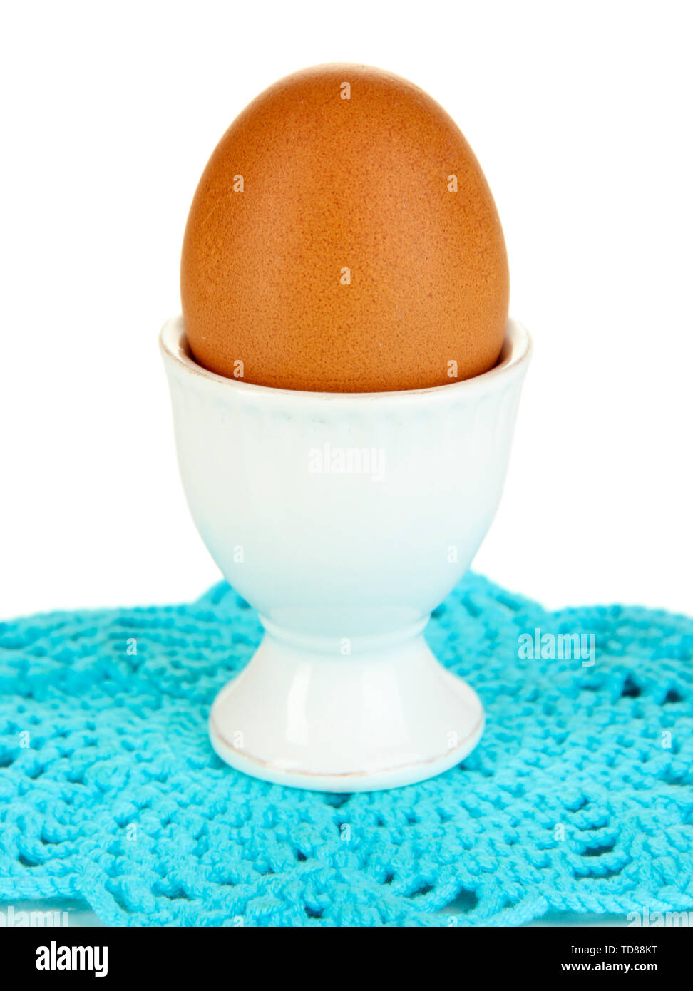 Whole boiled egg in egg cup isolated on white Stock Photo - Alamy
