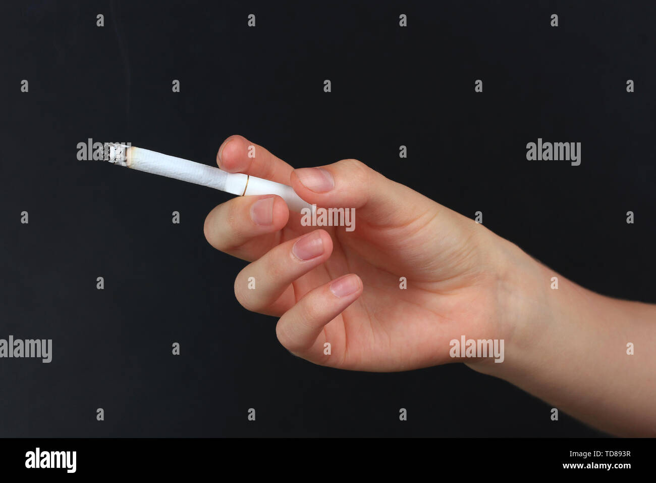 Hand and cigarette hi-res stock photography and images - Alamy