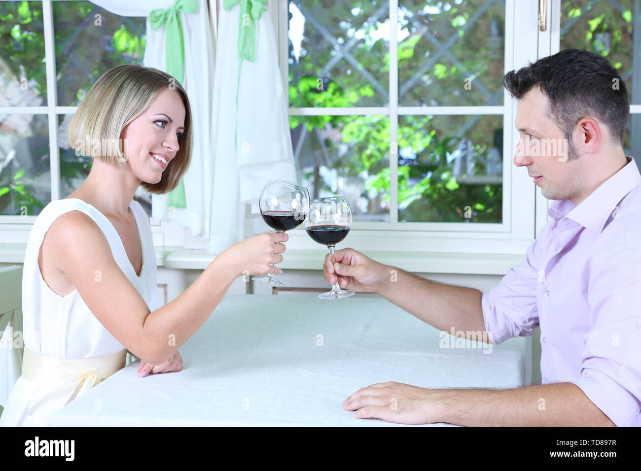 Beautiful couple having romantic dinner at restaurant Stock Photo - Alamy