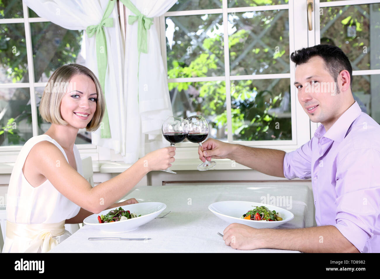 Beautiful couple having romantic dinner at restaurant Stock Photo - Alamy