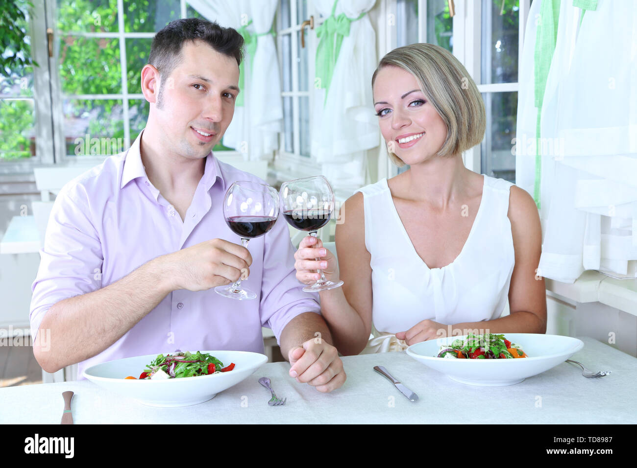 Beautiful couple having romantic dinner at restaurant Stock Photo - Alamy