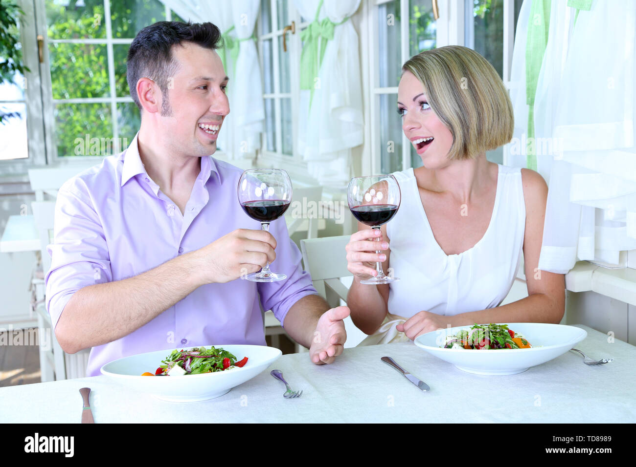 Beautiful couple having romantic dinner at restaurant Stock Photo - Alamy