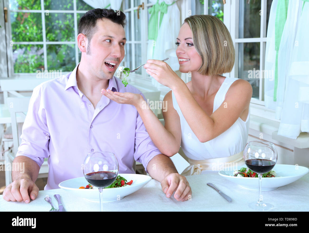 Beautiful couple having romantic dinner at restaurant Stock Photo - Alamy