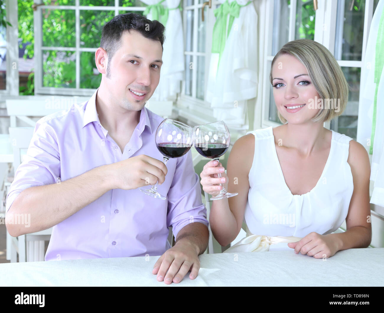 Beautiful couple having romantic dinner at restaurant Stock Photo - Alamy