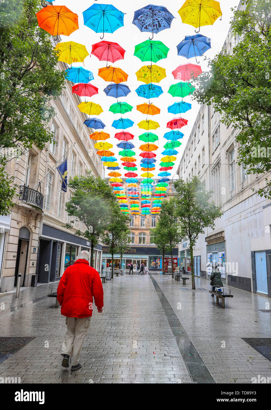 Members of the public walk beneath the ADHD Foundation's Umbrella ...