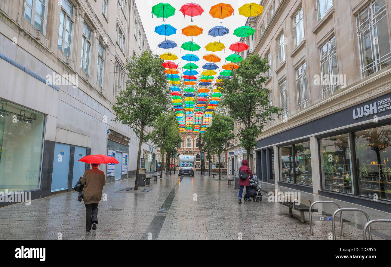 Members of the public walk beneath the ADHD Foundation's Umbrella ...