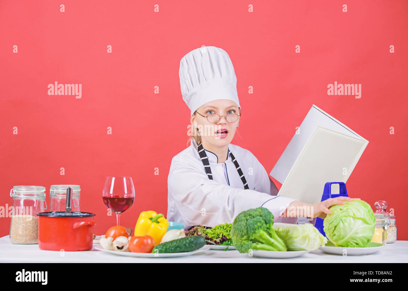 Female in hat and apron knows everything about culinary arts. Culinary ...