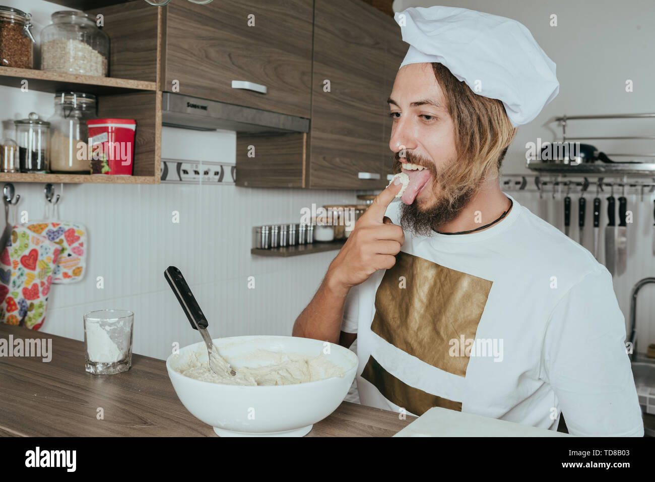Baker is testing dough before cooking Stock Photo - Alamy