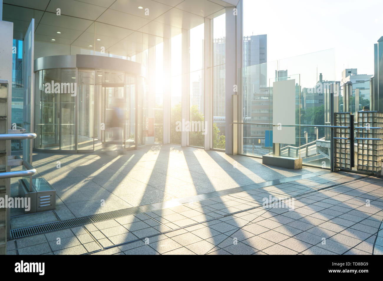 empty footpath through modern office buildings in tokyo with sun Stock ...