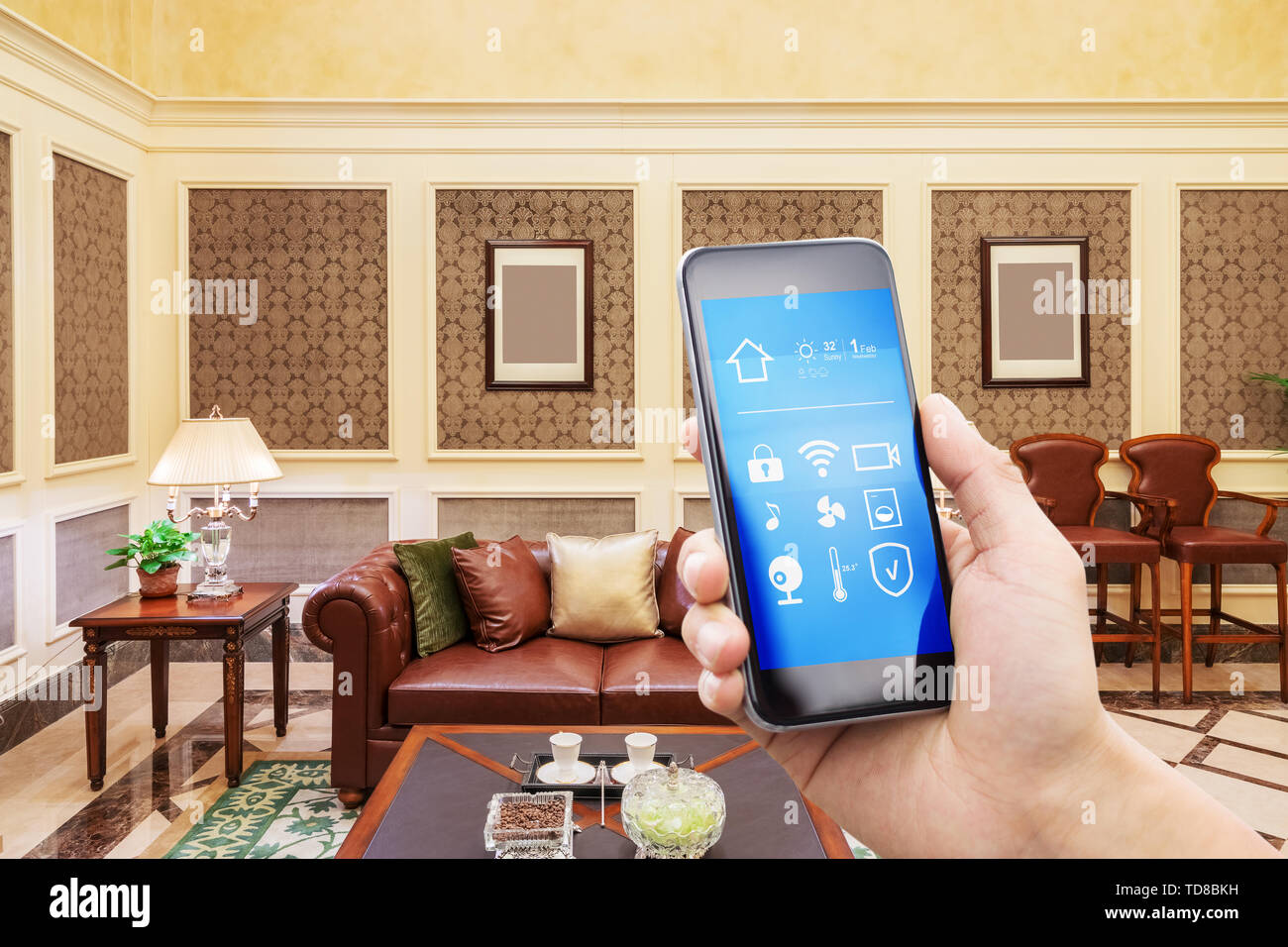 Mobile phone with modern living room Stock Photo - Alamy