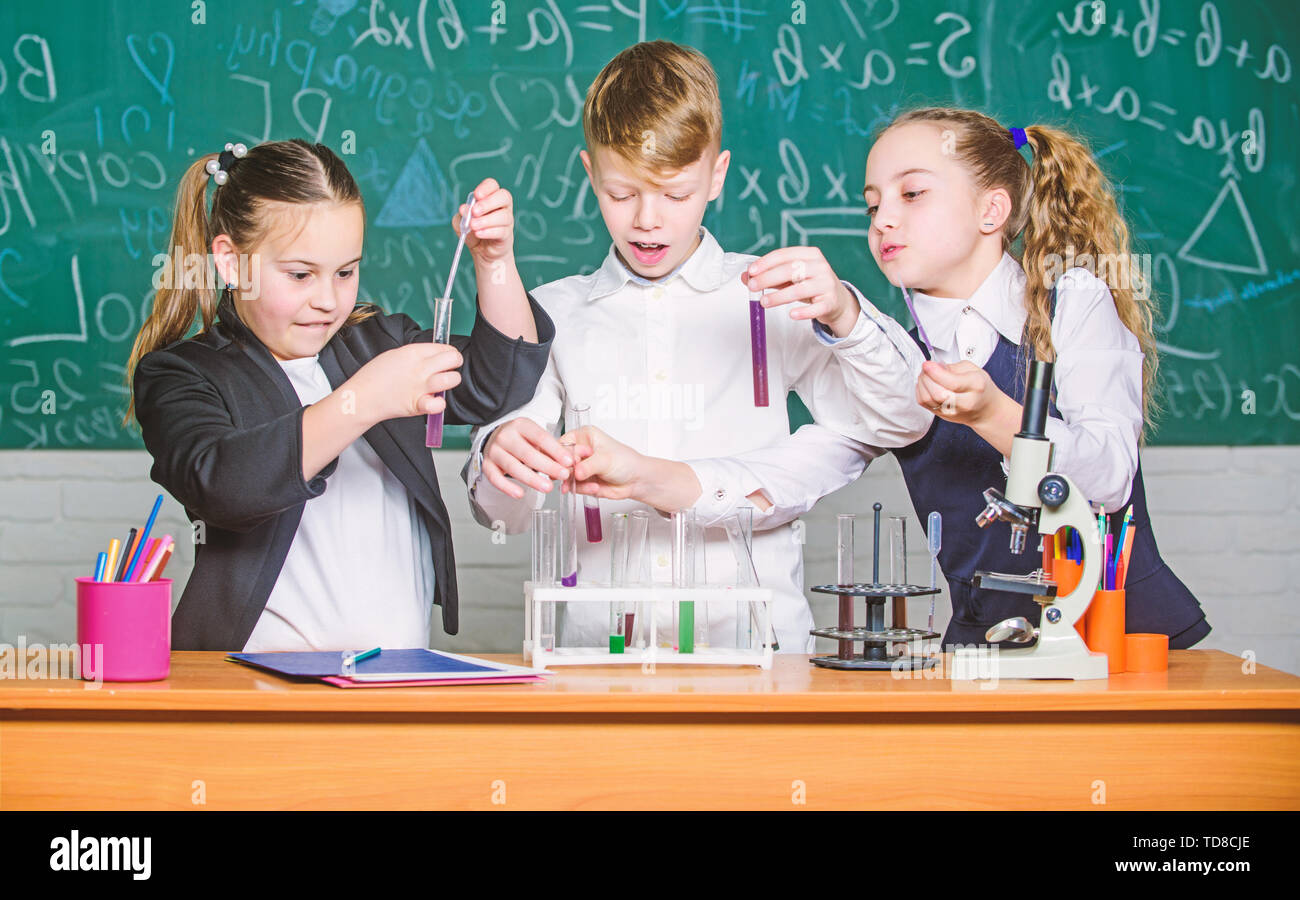 biology education. Little kids learning chemistry in lab. students ...