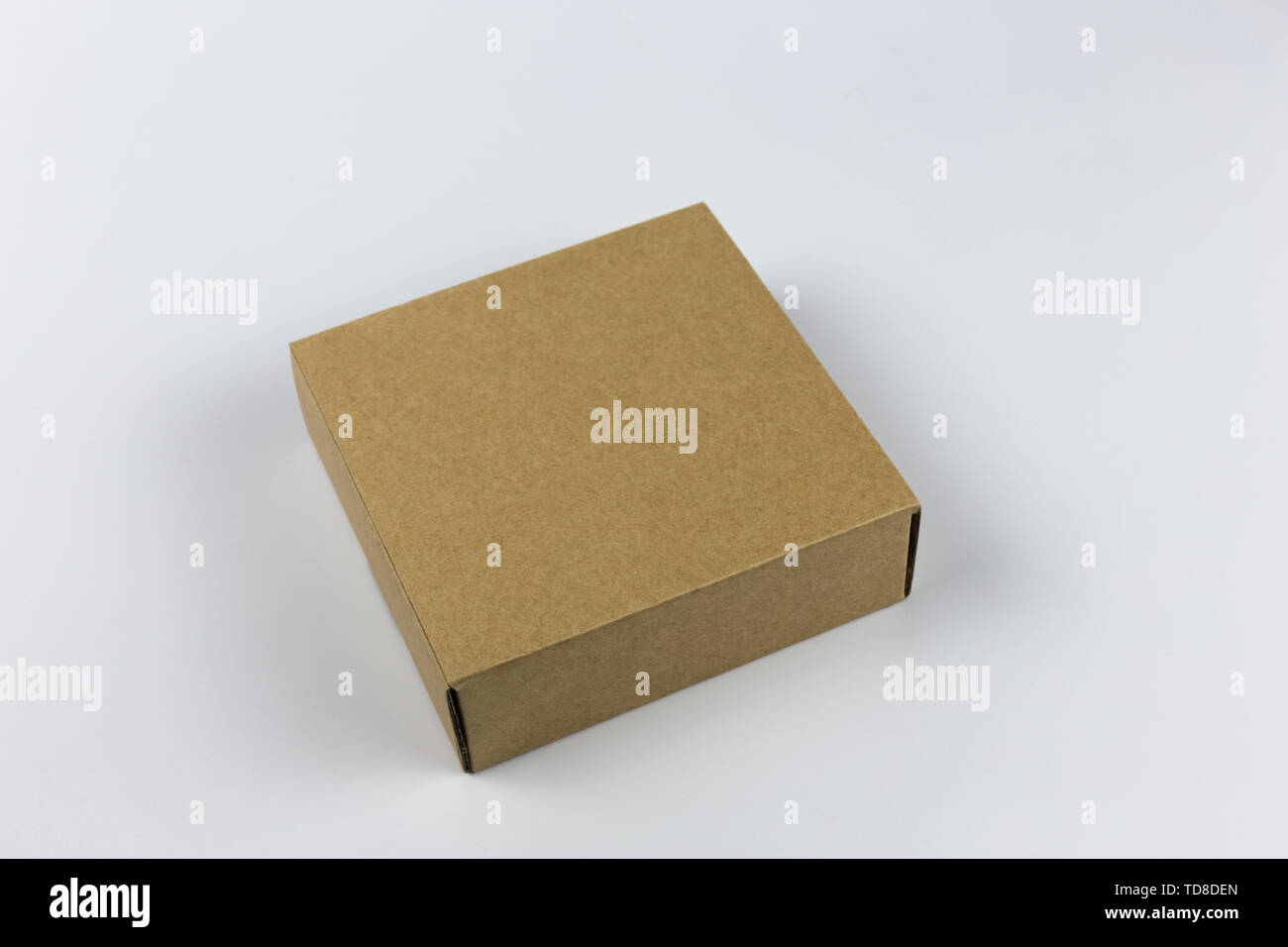 isolated yellow paper box on white background Stock Photo - Alamy