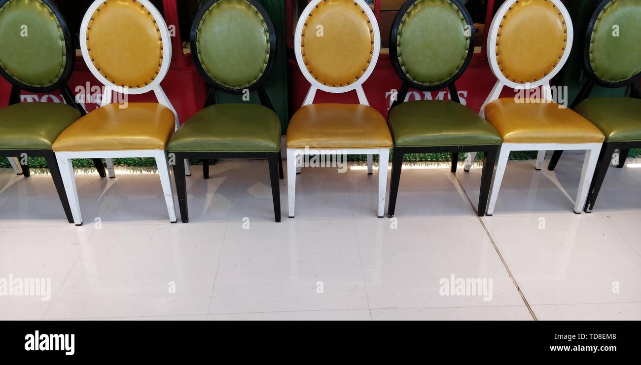 Chairs and stools in various colors and shapes Stock Photo - Alamy