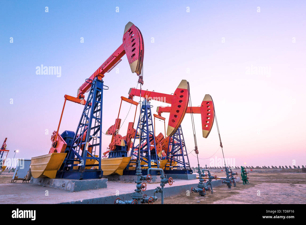 Oil working at oil field Stock Photo - Alamy