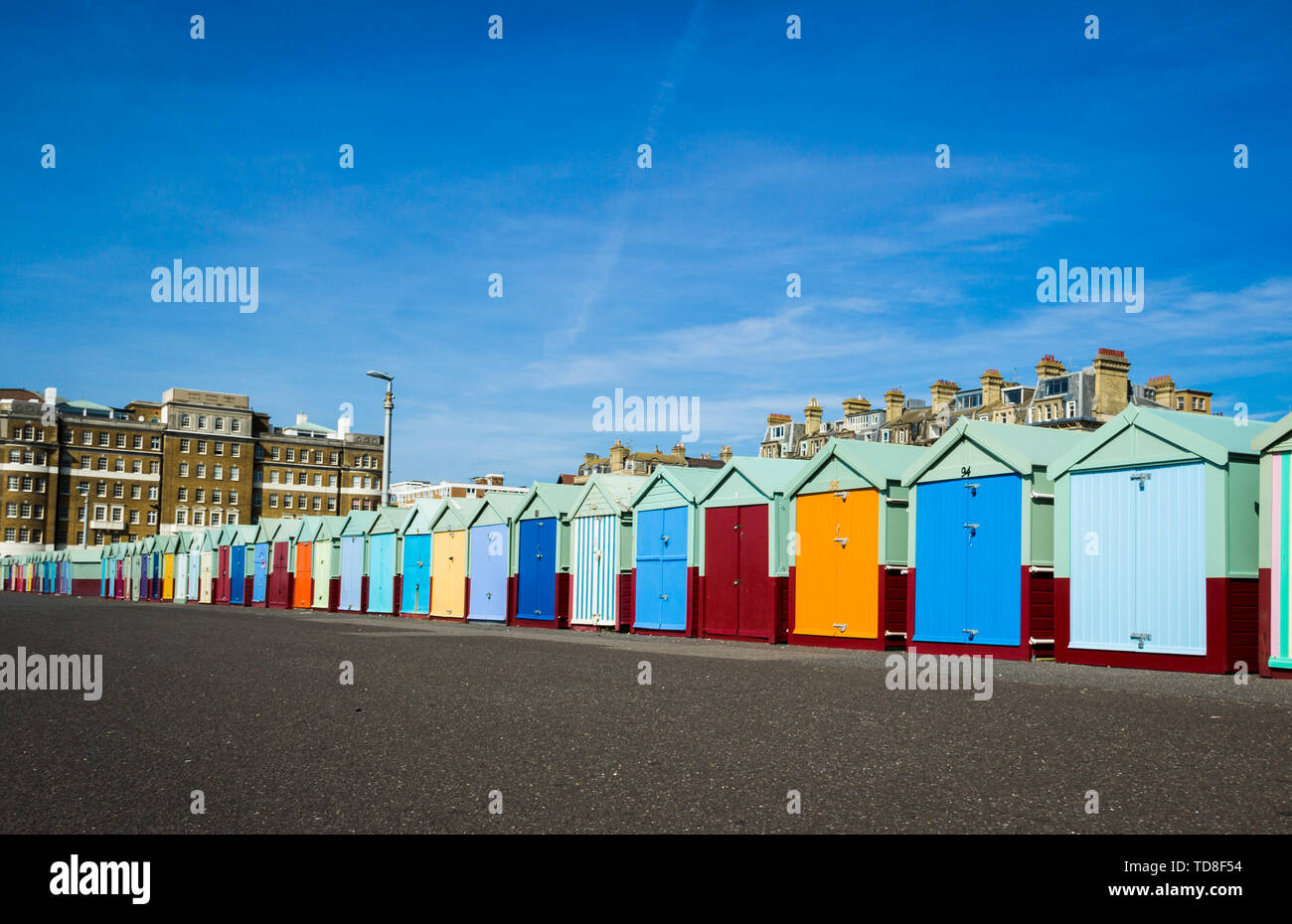 Landscape with row of colorful beach huts of Hove, Brighton, UK. Blue ...