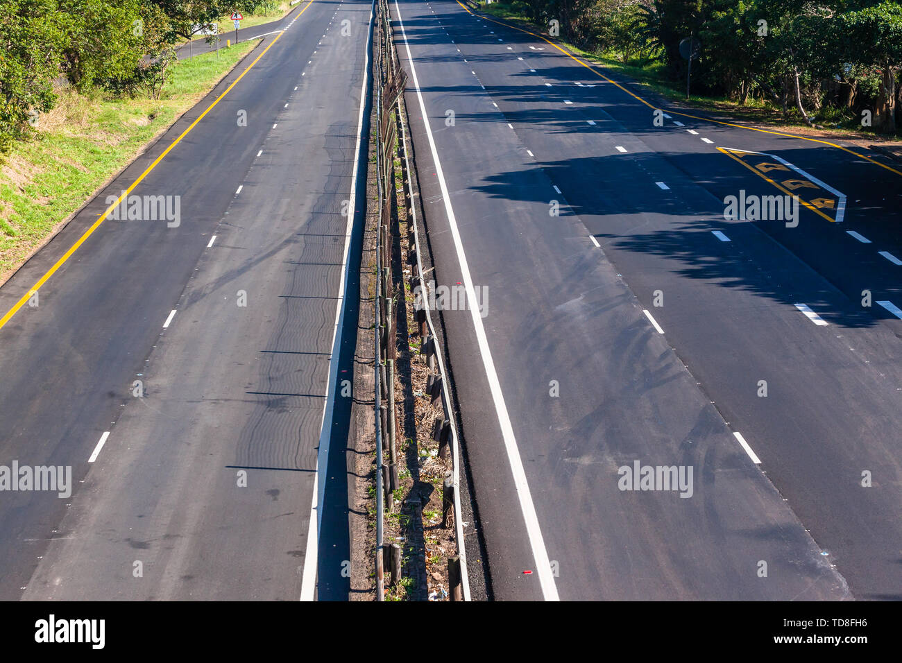 Road highway new section of asphalt tar white painted lines on two ...